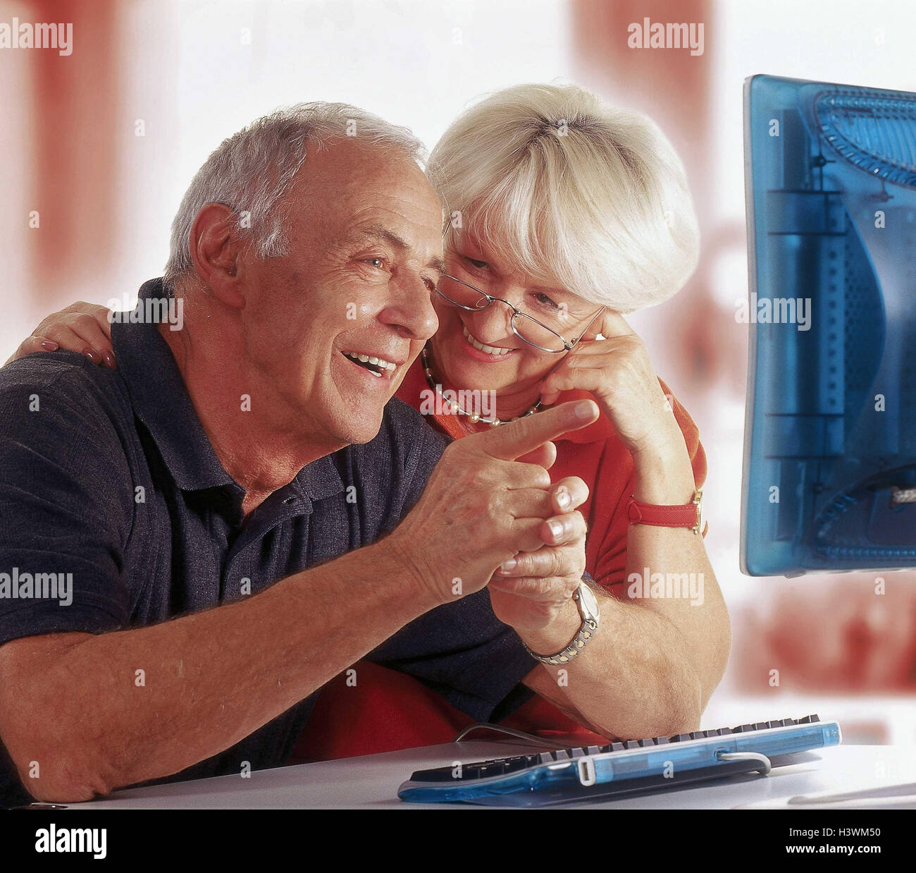 Senior couple, desk, computer, detail, keyboard, flat screen, happy ...