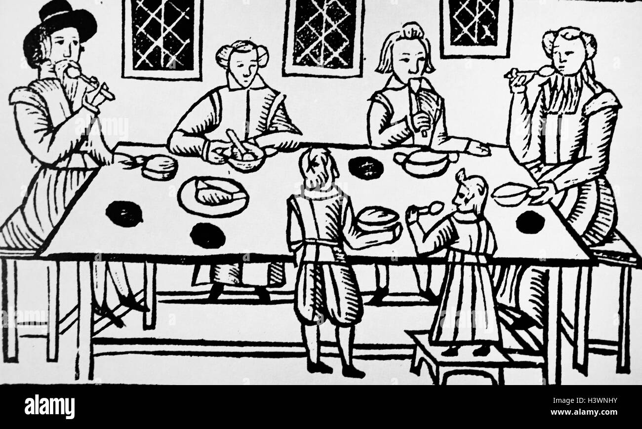 Medieval, Spanish nobles eat at a feast attended to by servants. Circa ...