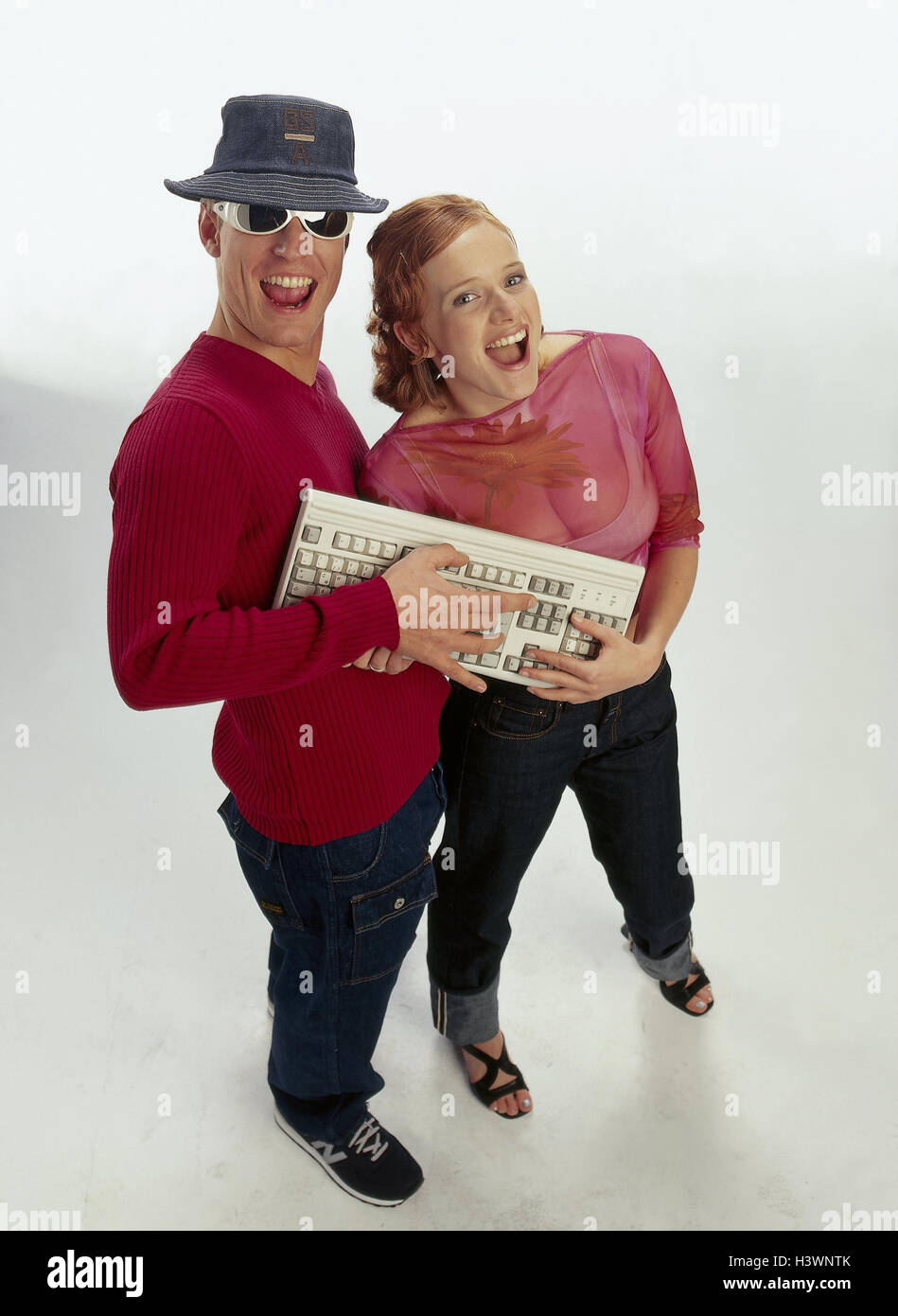 Couple, young, happy, computer keyboard, inside, cut out, studio, care ...