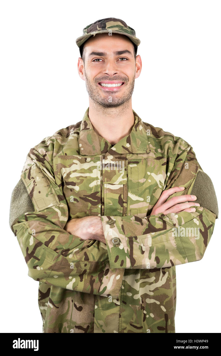 Portrait of smiling soldier standing with arms crossed Stock Photo - Alamy