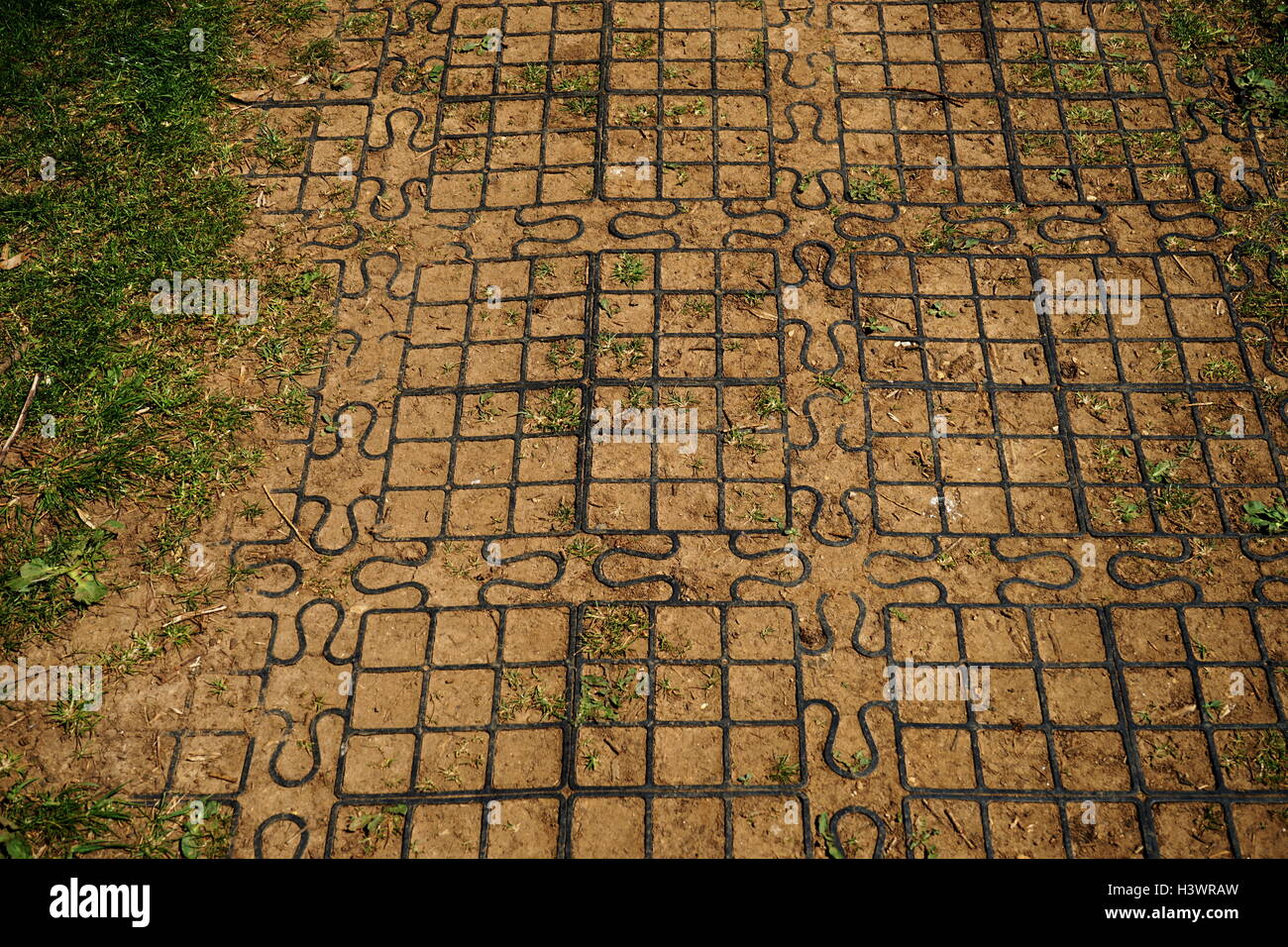embedded grill matt placed on a footpath to provide grip for walkers ...