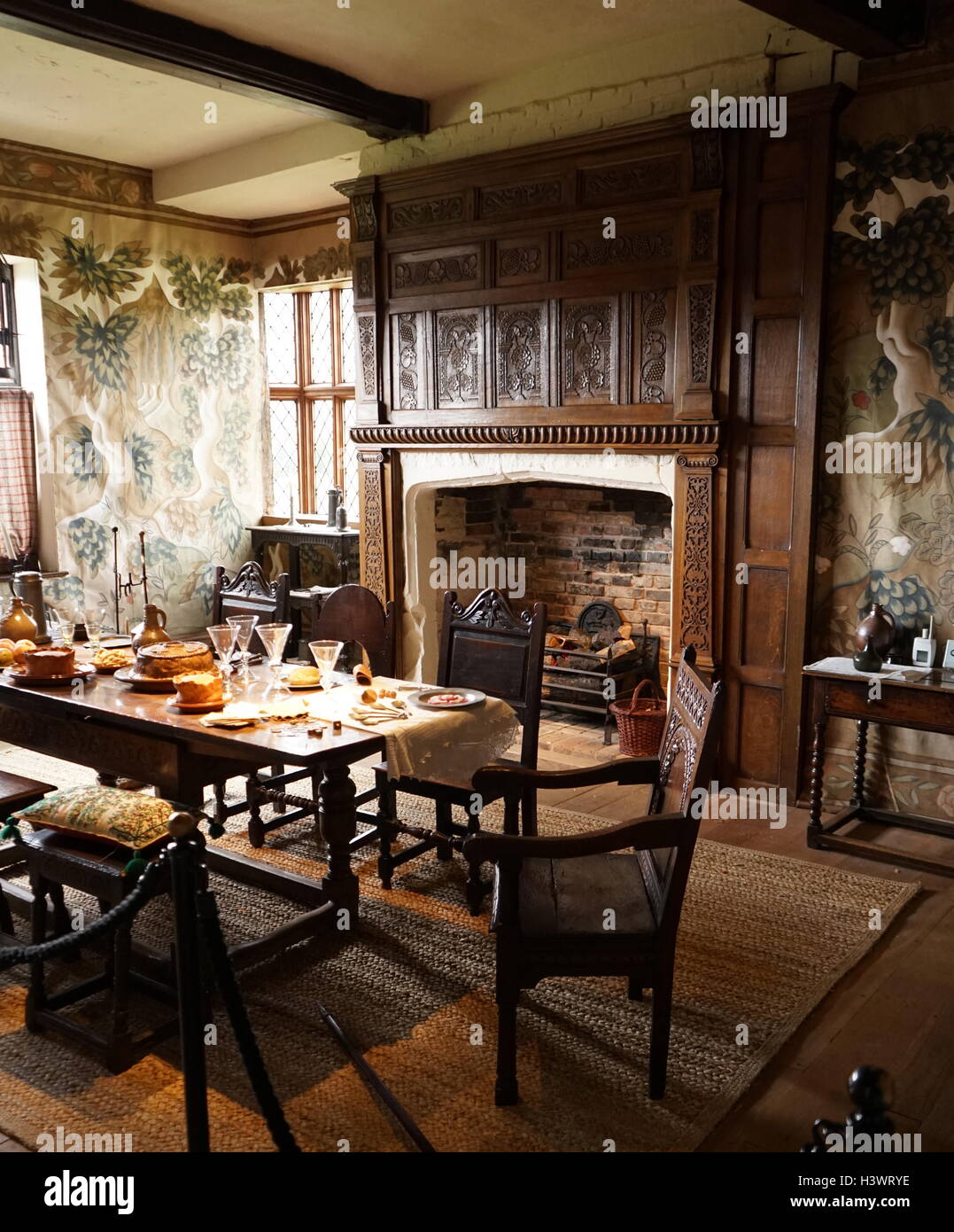 Elizabethan dining table set with typical foods, at Blakesley Hall is a ...