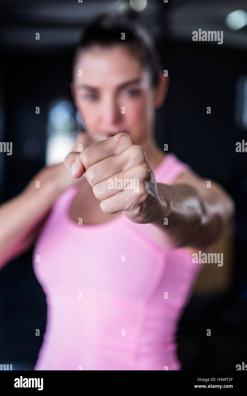 Portrait of female athlete punching Stock Photo - Alamy