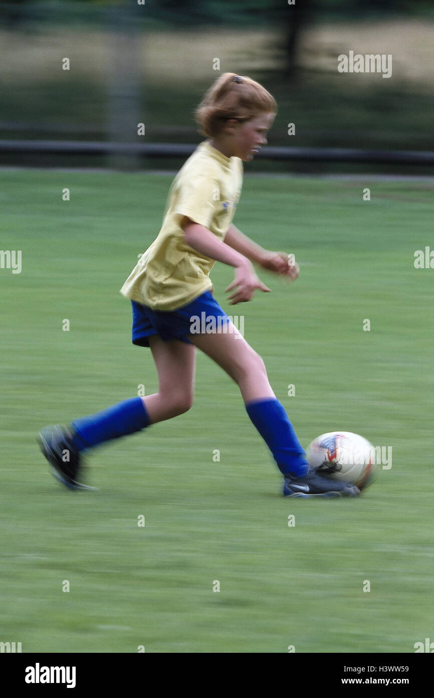 Football pitch, girl, sports kit, to football matches, model released ...