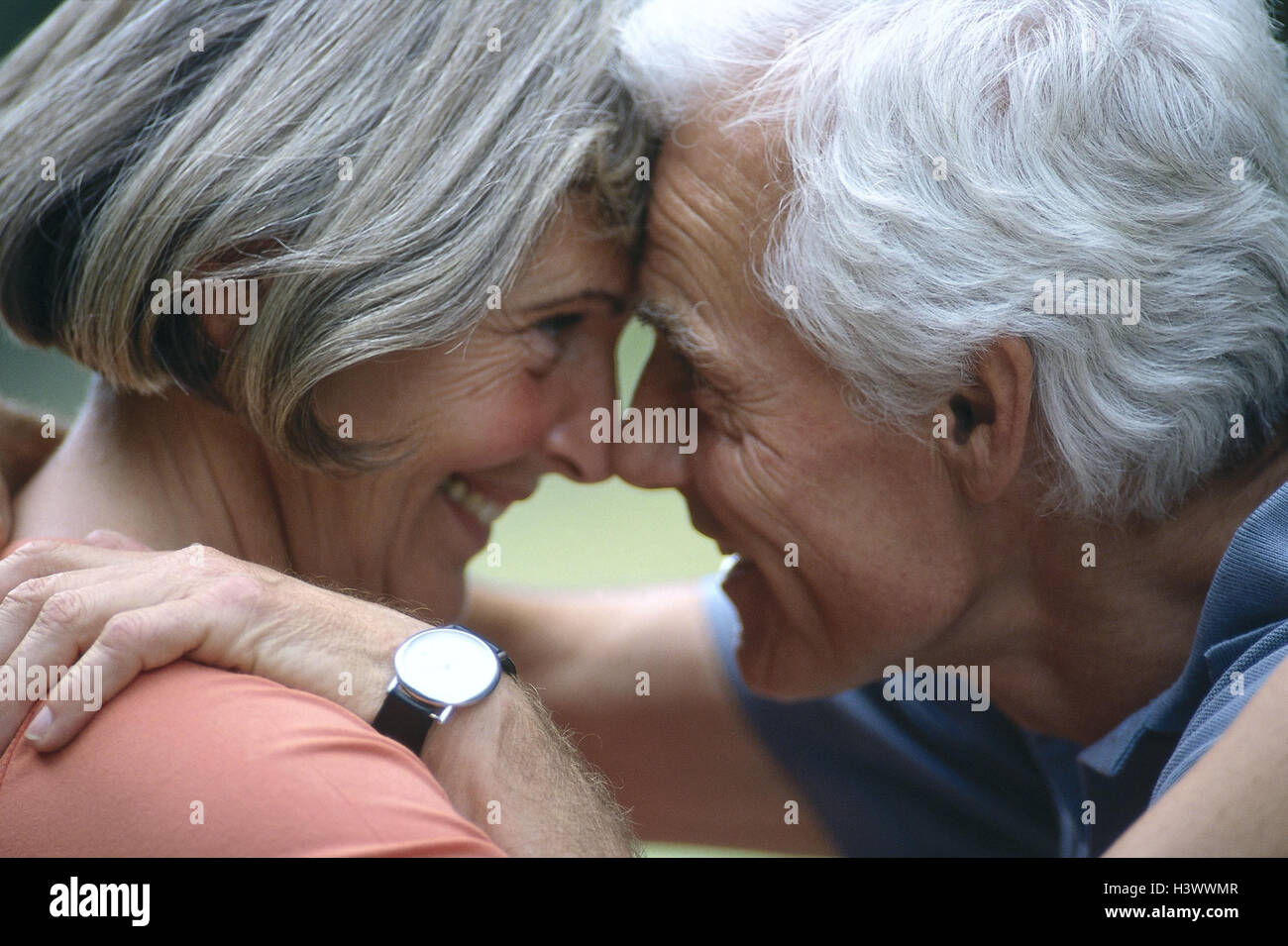Senior couple, happy, embrace, eye contact, side view, detail, model ...