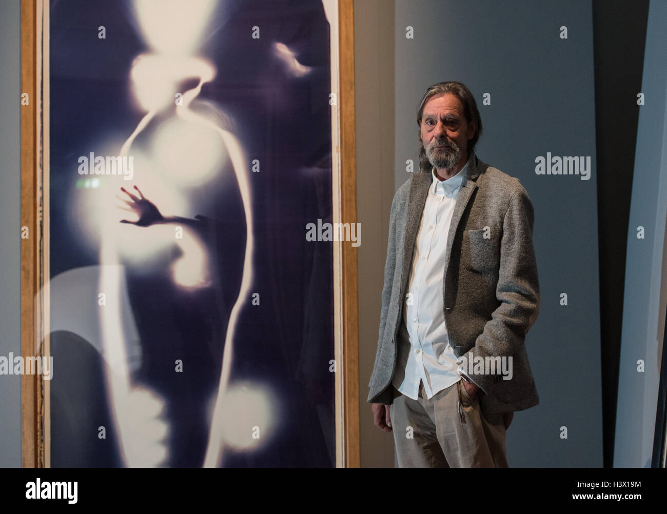 Performing artist Ulay stands next to the artwork 'Self-Portrait' (1990 ...