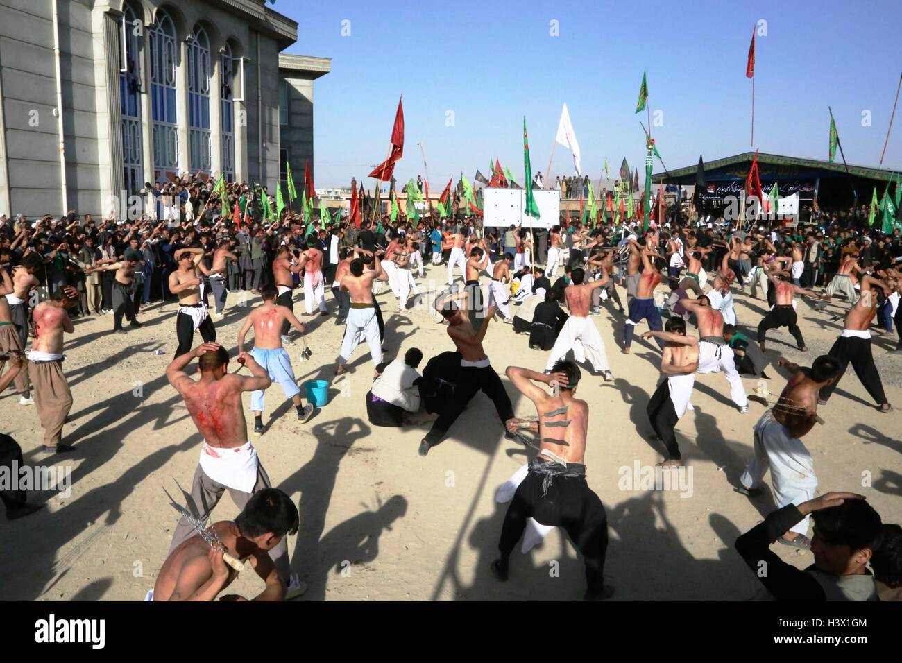 Ghazni, Afghanistan. 12th Oct, 2016. Afghan mourners flagellate ...