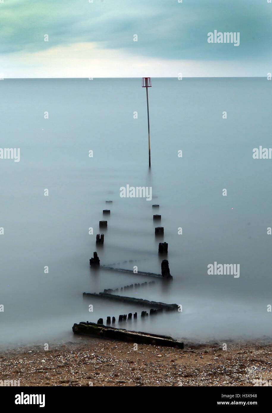Heacham, UK. 13th Oct, 2016. Groyne and groyne marker. The tide slowly ...
