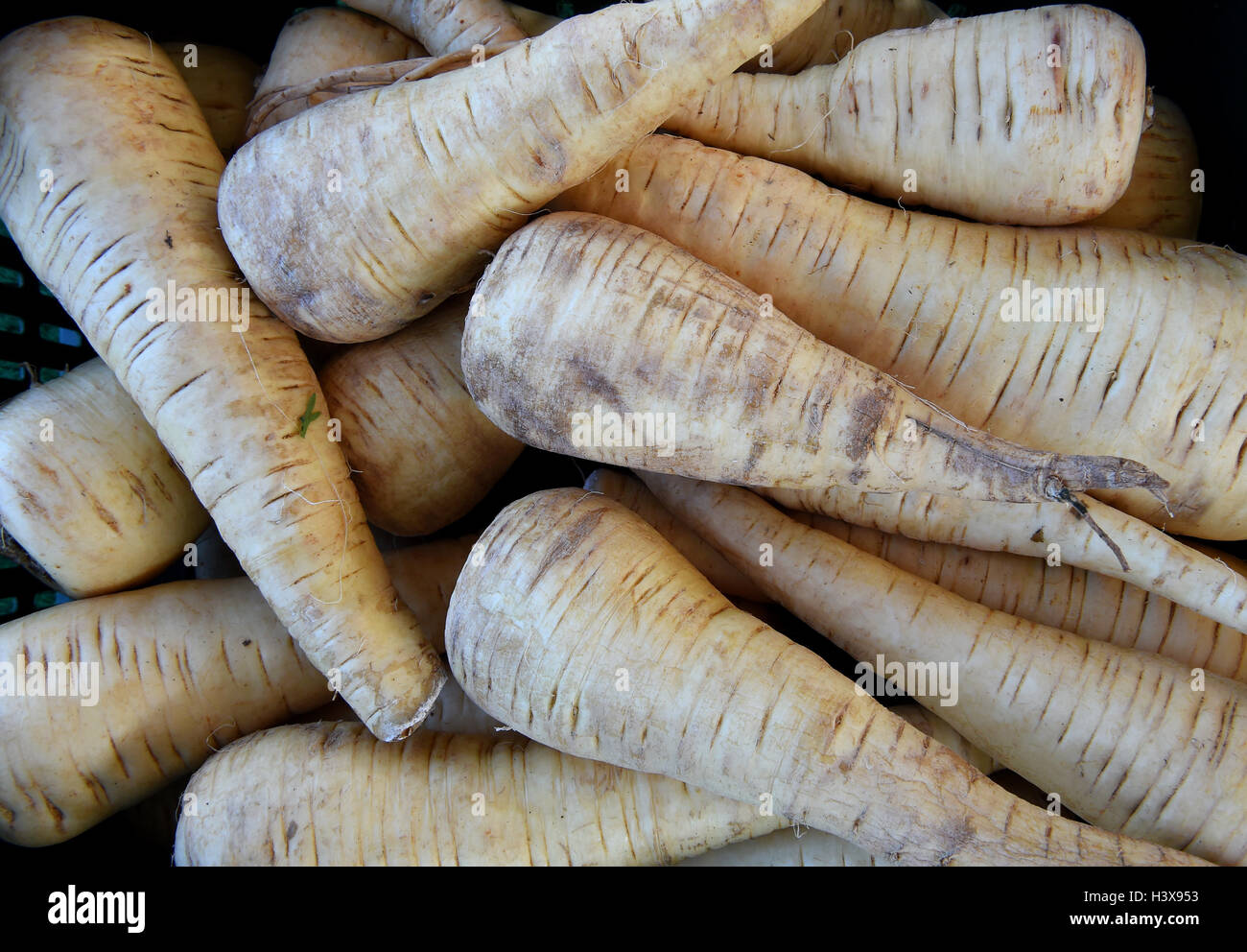 Parsnips are for sale at a market stall on the weekly market in ...