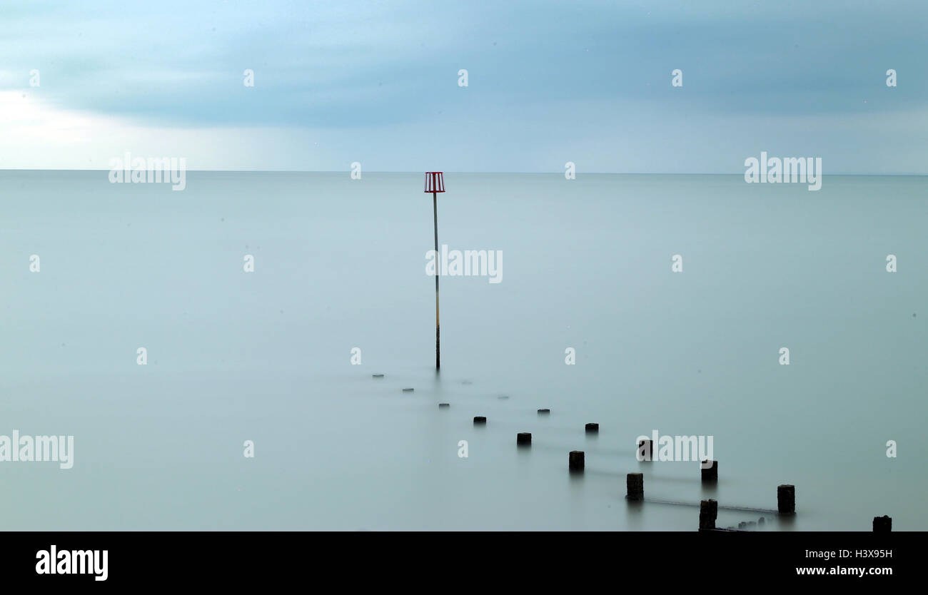 Heacham, UK. 13th Oct, 2016. Groyne and groyne marker. The tide slowly ...