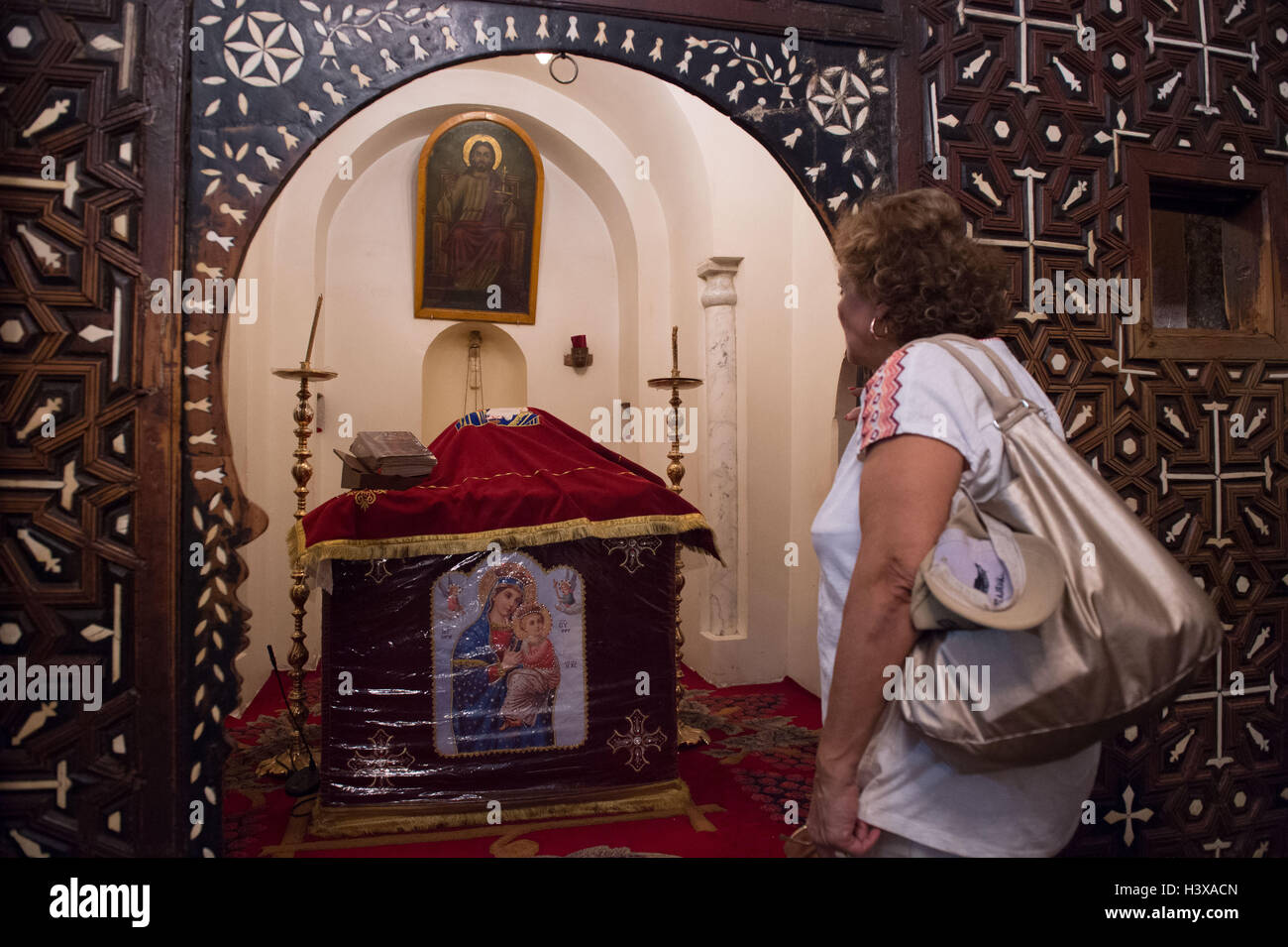 Assiut, Egypt. 11th Oct, 2016. A woman visits the cubic-shaped altar ...
