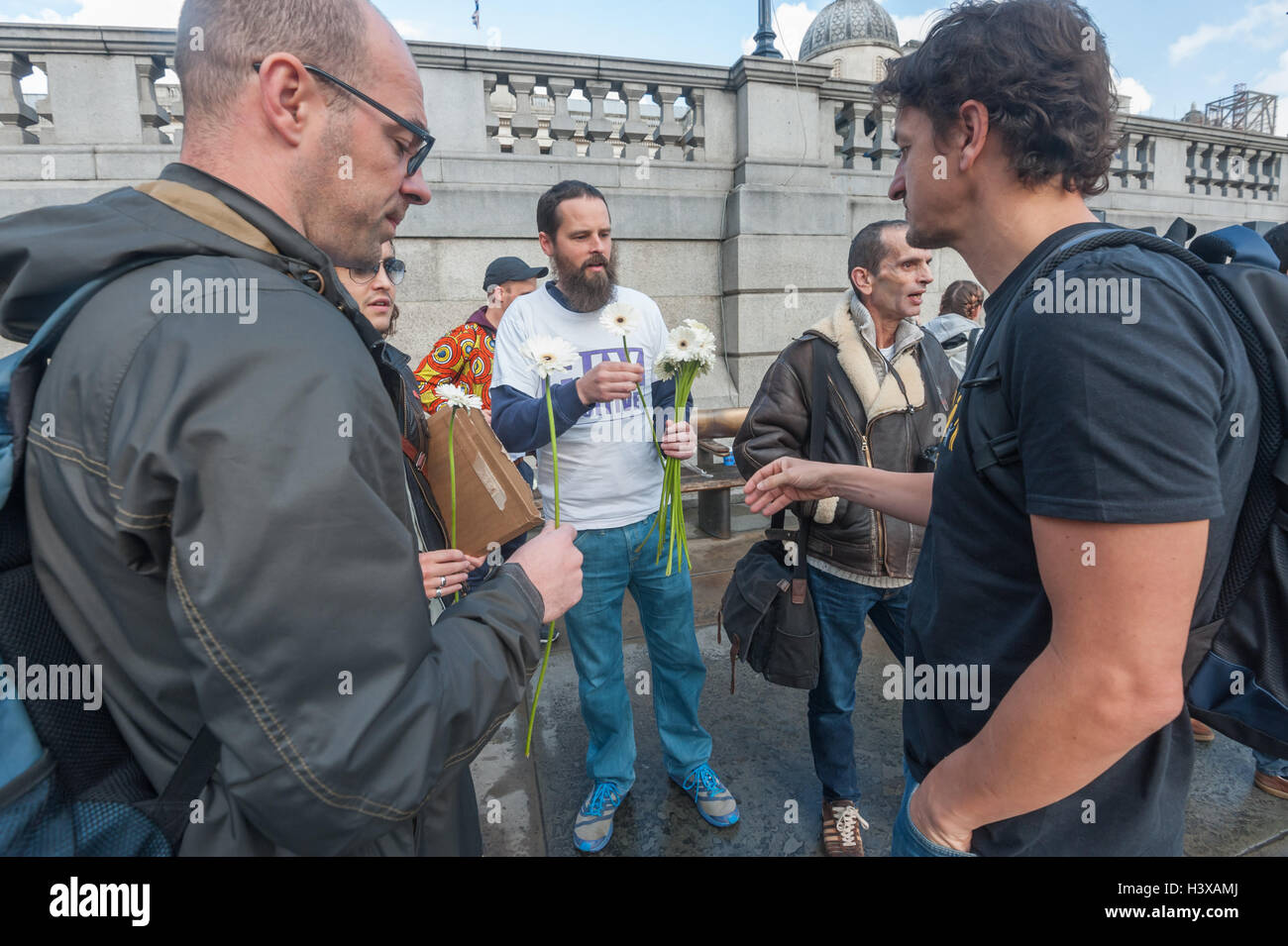 Protesters carry flowers hi-res stock photography and images - Alamy