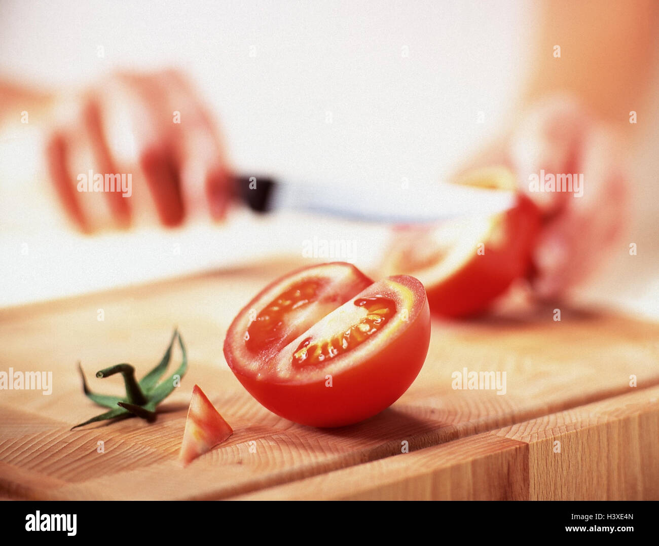 Cuisine, woman, detail, wooden springboard, tomato, halve, cut made ...