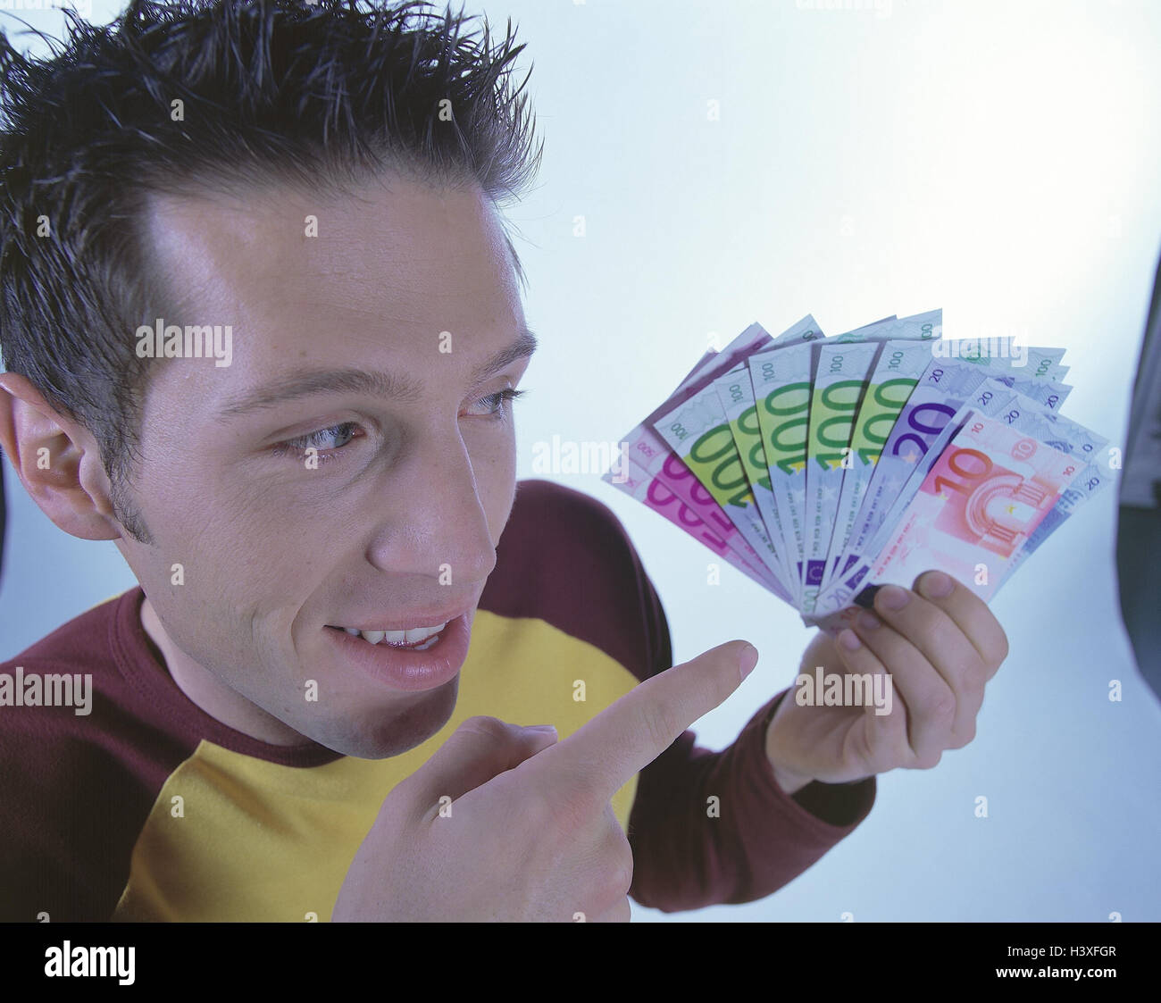 Man, hand, euro, bank notes, gesture, pointing, portrait, inside, young ...