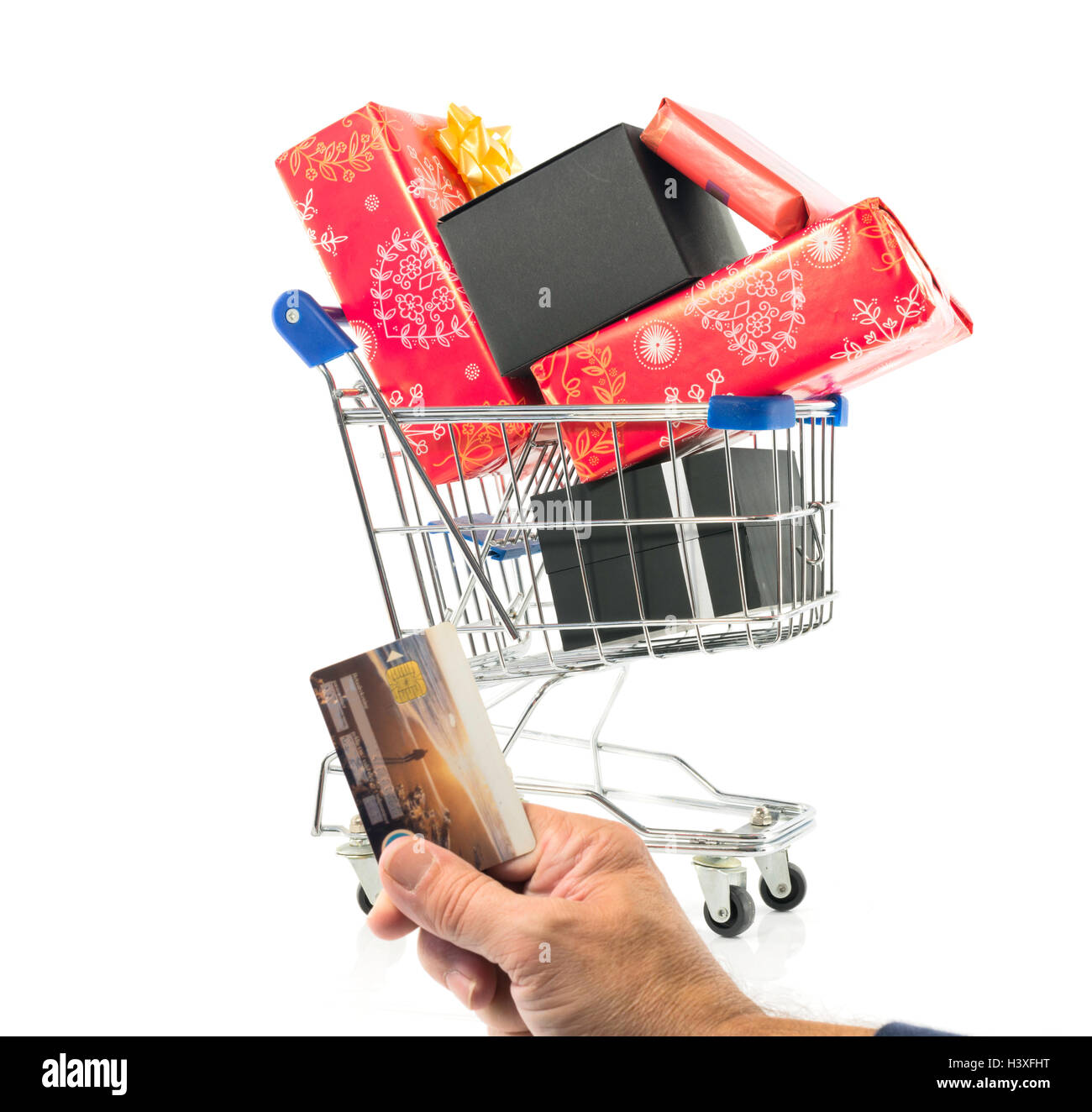 paying the presents in the shopping cart with credit card of bank card ...