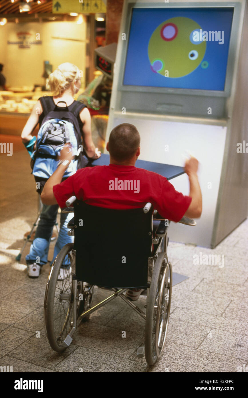 Amusement arcade, machine, man, invalid, wheel chair, woman, walking ...