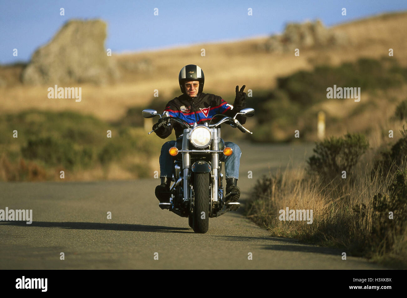 Chopper driver with Yamaha on mountain road Stock Photo - Alamy