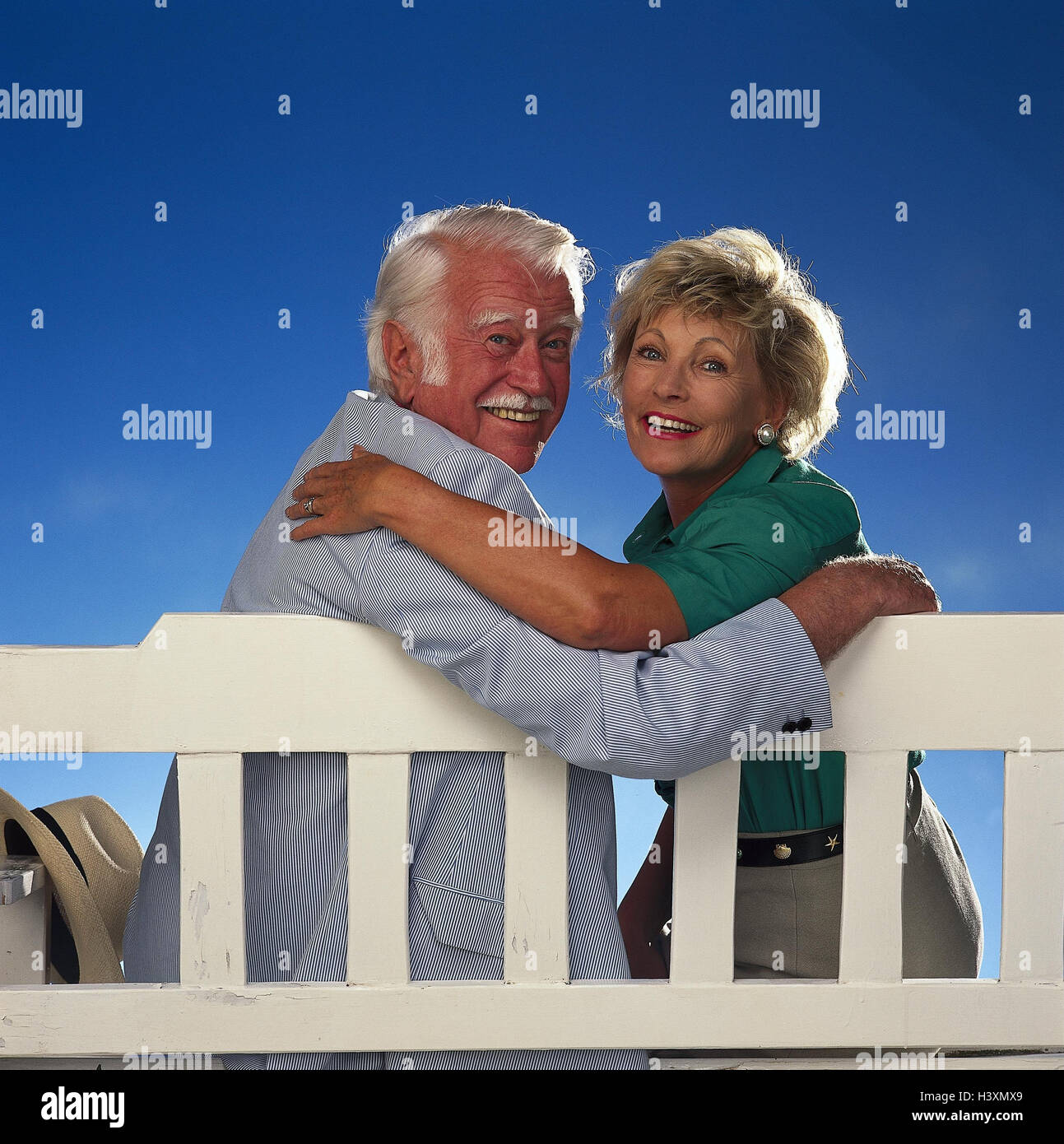 Senior citizens, couple, bank, sit, embrace, happy, back view, view ...