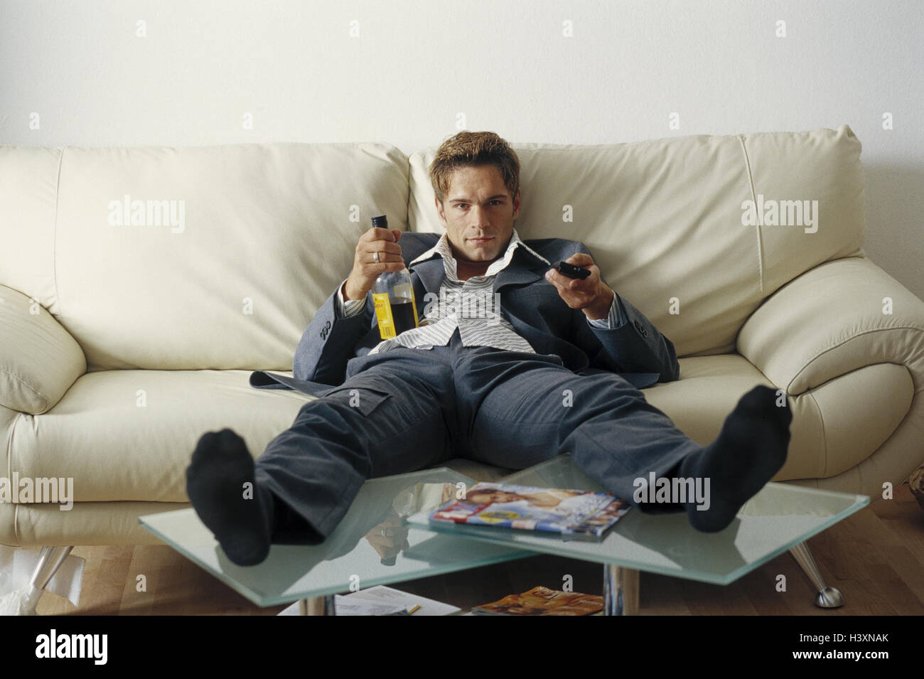 Man, sit young, sofa, television, schnapps Bottle, lonely, sadly couch ...