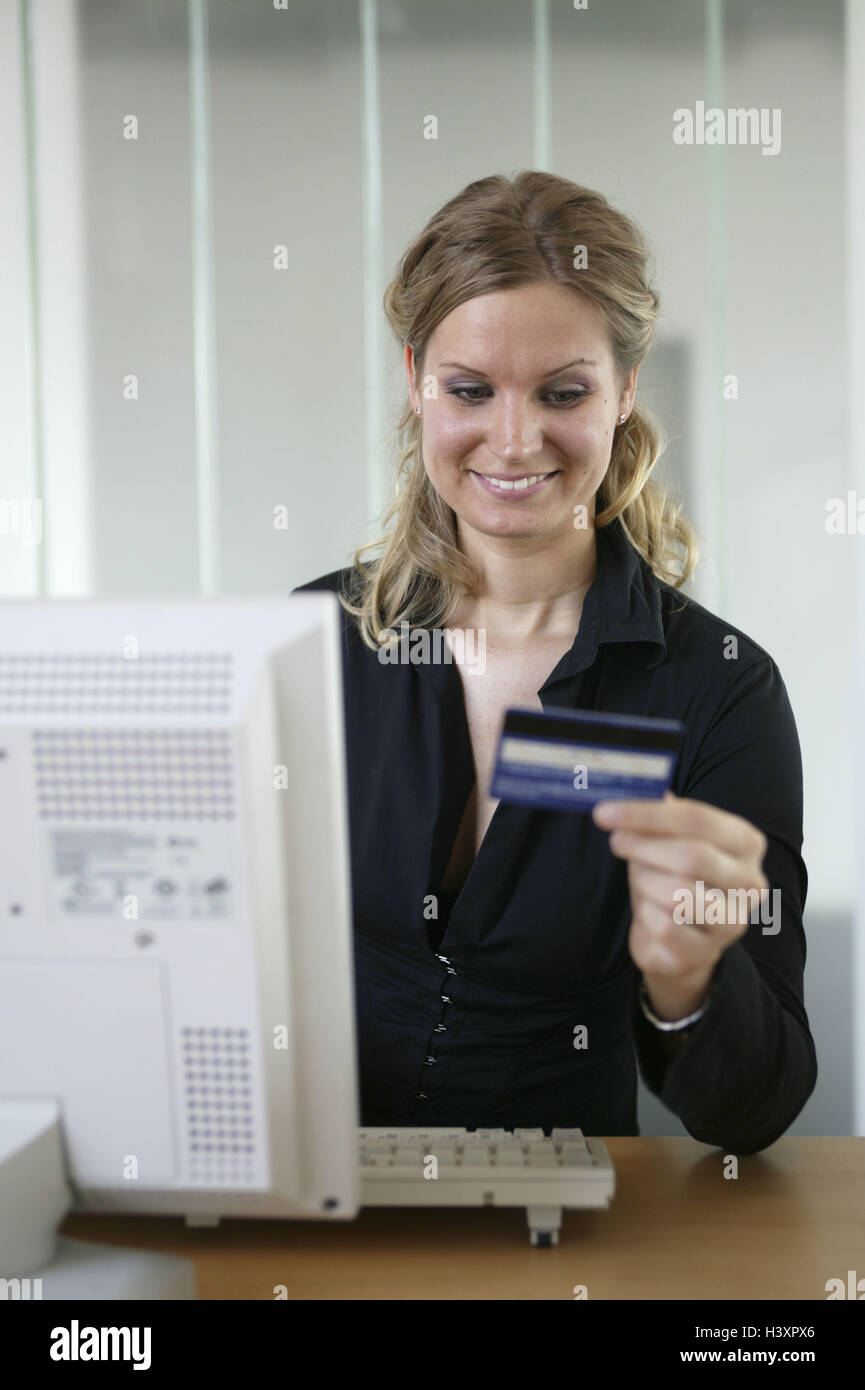 Woman, happy, gesture, credit card, computer, half portrait, office ...