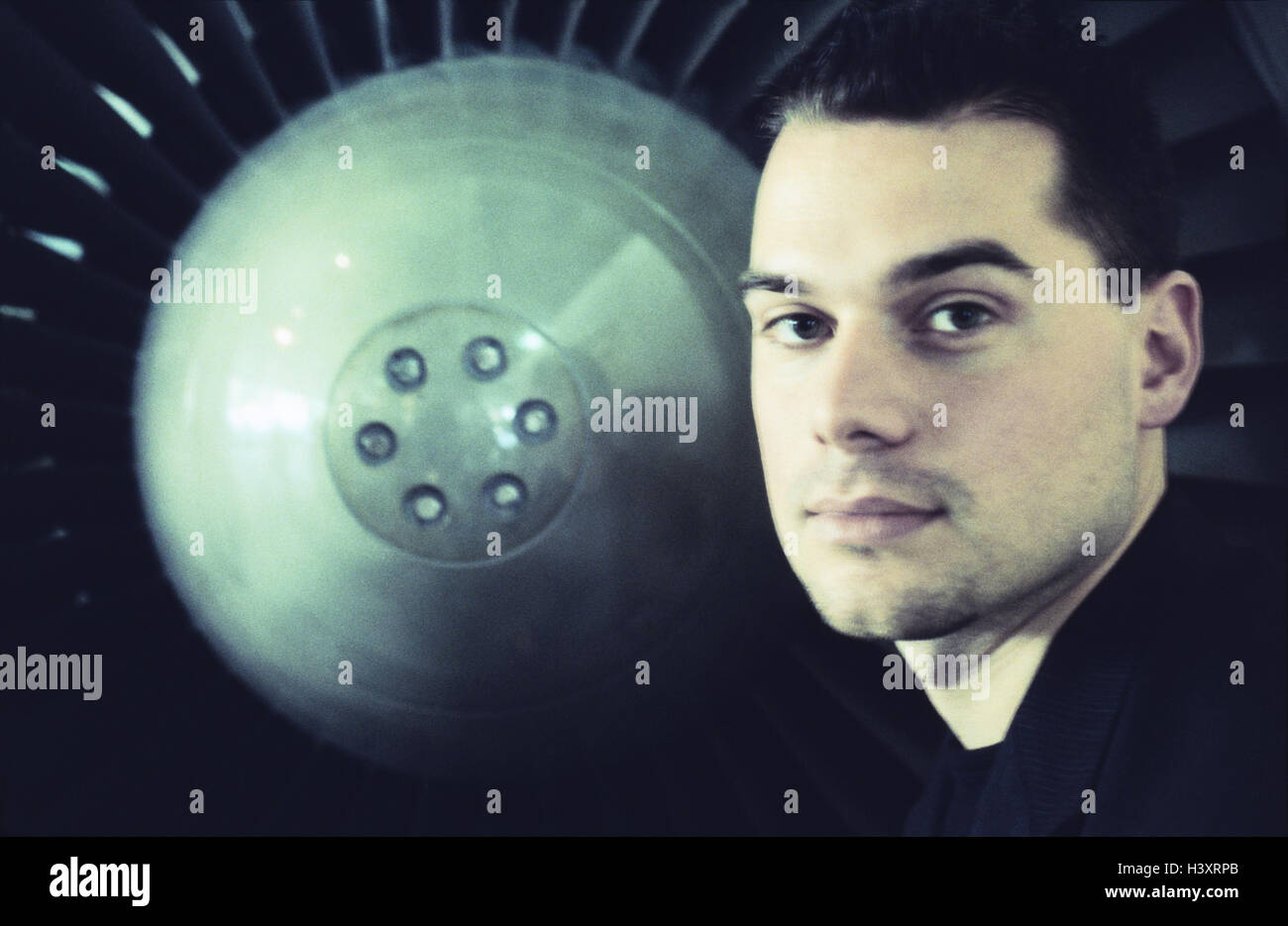 Man, portrait, airplane turbine, detail, young, dark-haired, technology ...