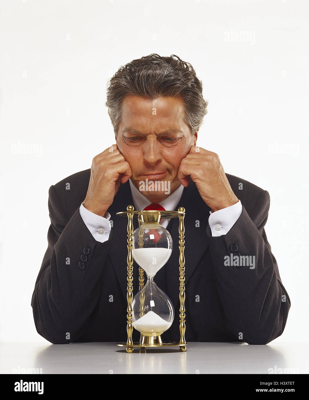 Man, middle old person, suit, head, rest on, hourglass, facial play ...