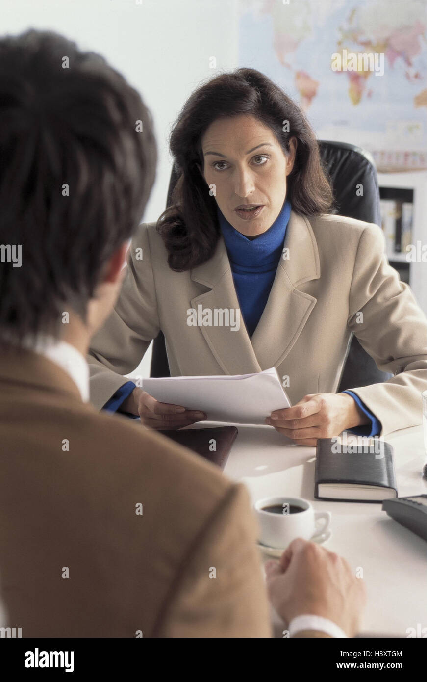 Office, desk, businesswoman, man, back view, conversation inside ...