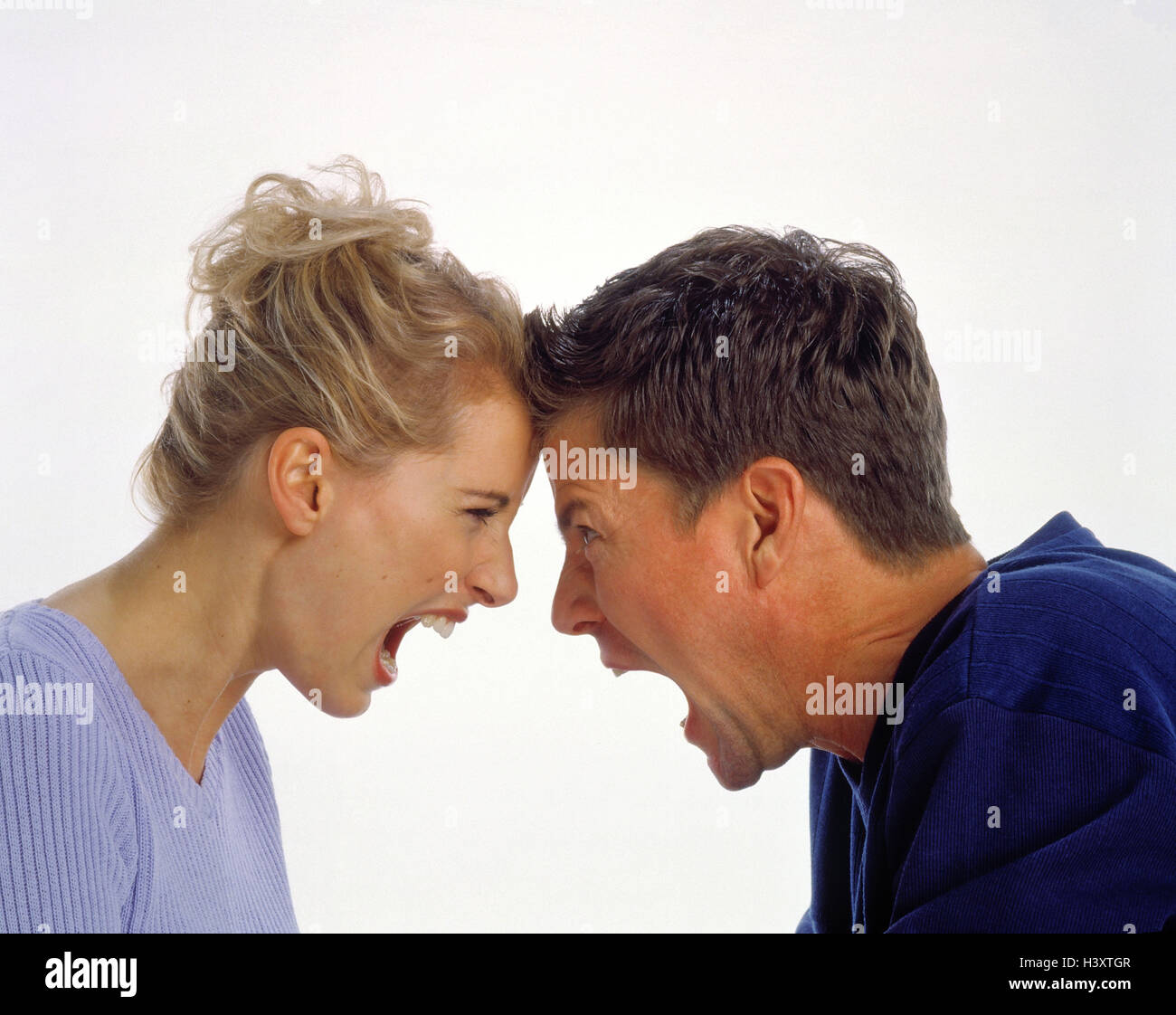 At couple, young, closely packed, conflict, fight, shout, tread ...