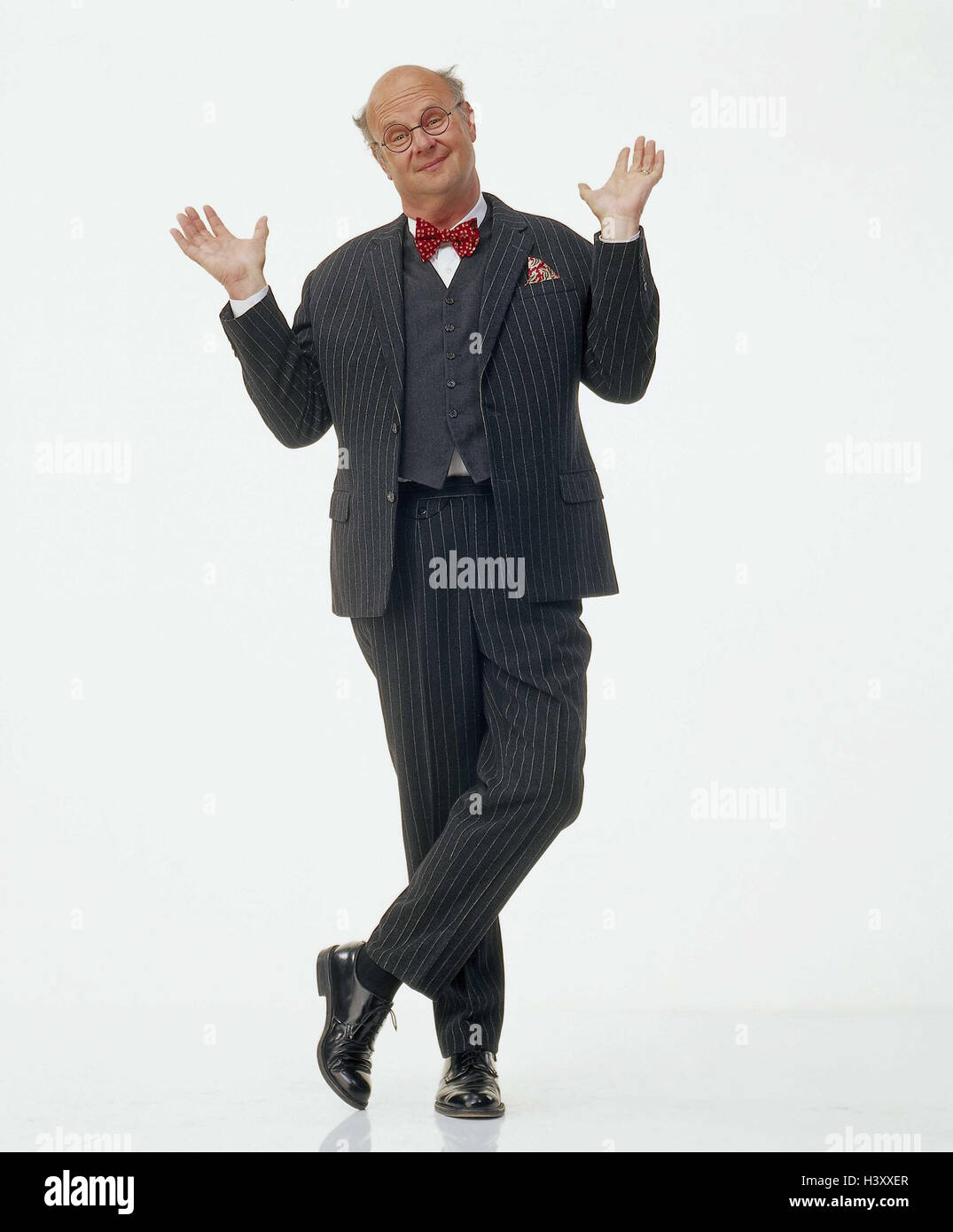 Man, forehead bald head, glasses, suit, stand, clear gesture, defence ...