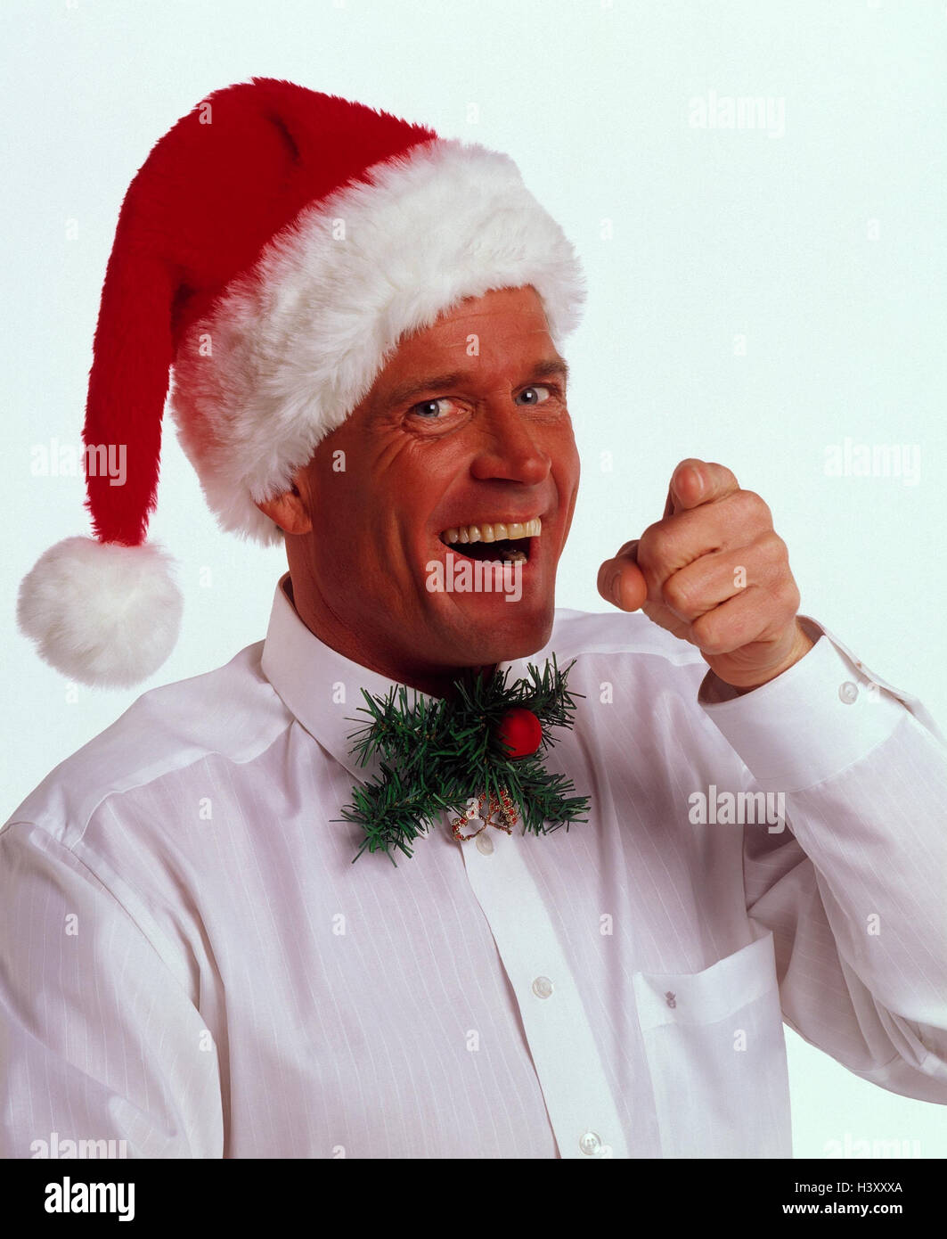Man, Santa's hat, gesture, pointing, happy, portrait, studio, cut out ...