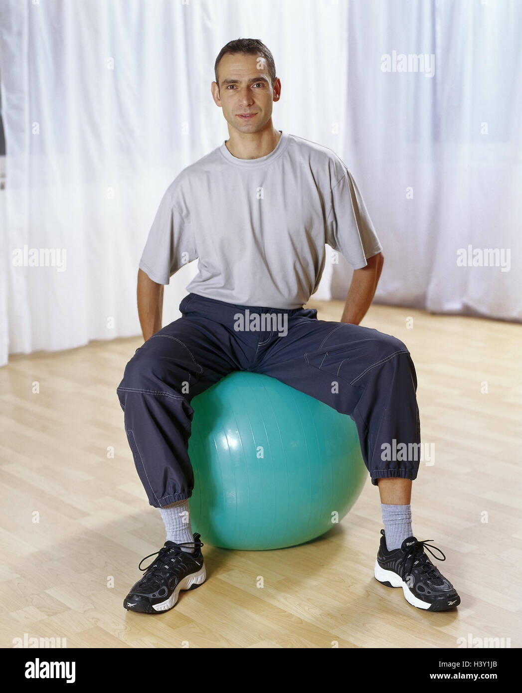 Man, cymbal floor exercises, gymnastics ball, sit gymnastics, practise ...