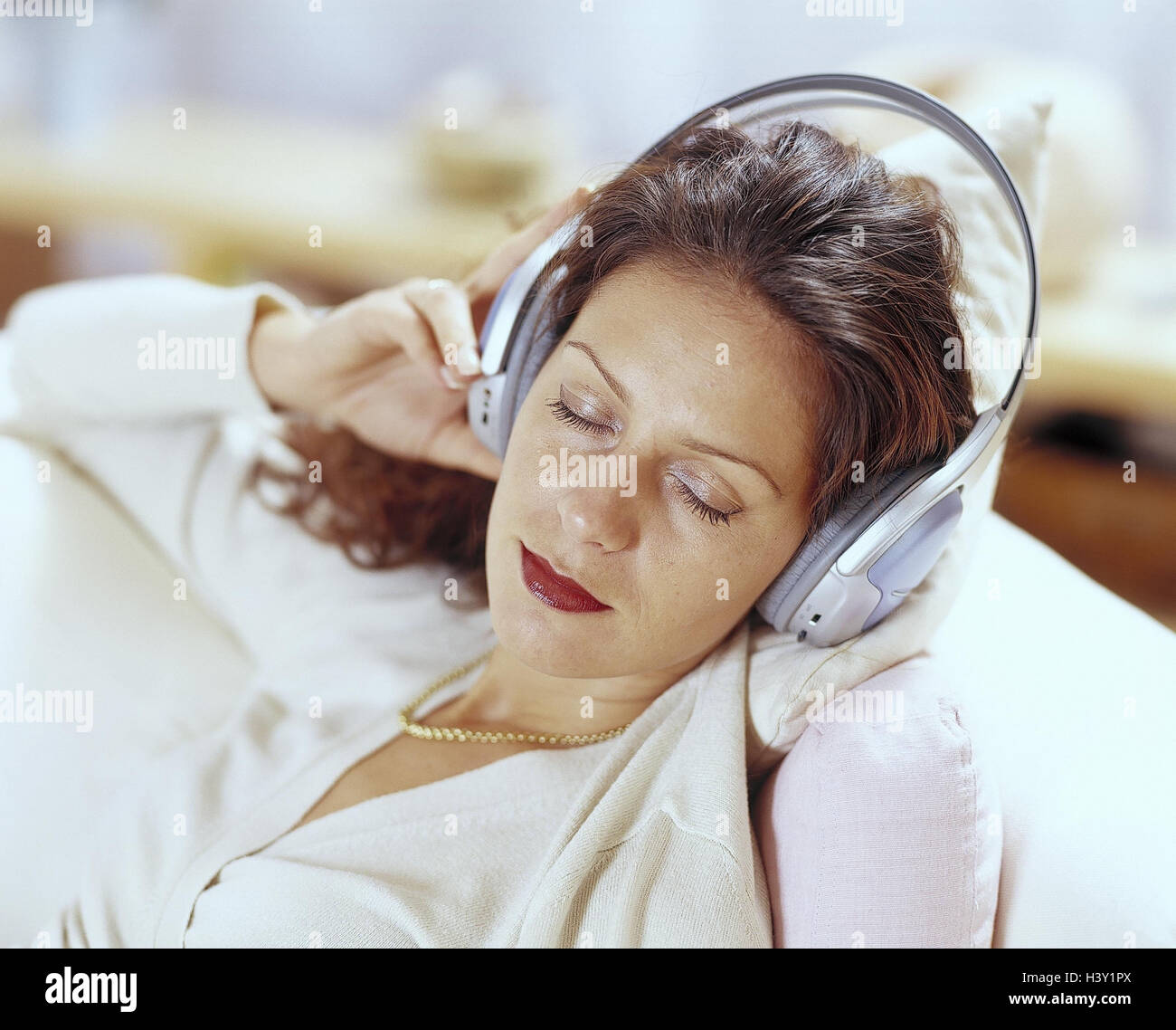 Sofa, woman, earphone, relaxing, portrait, inside, at home, privately ...