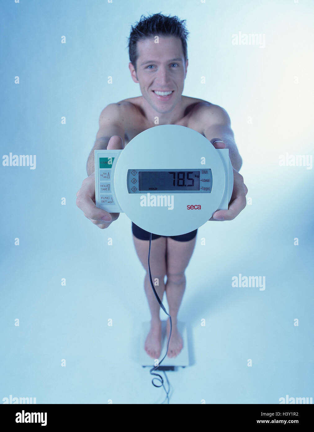 Man, boxers, bathroom scales, facial play, satisfaction, inside, young ...