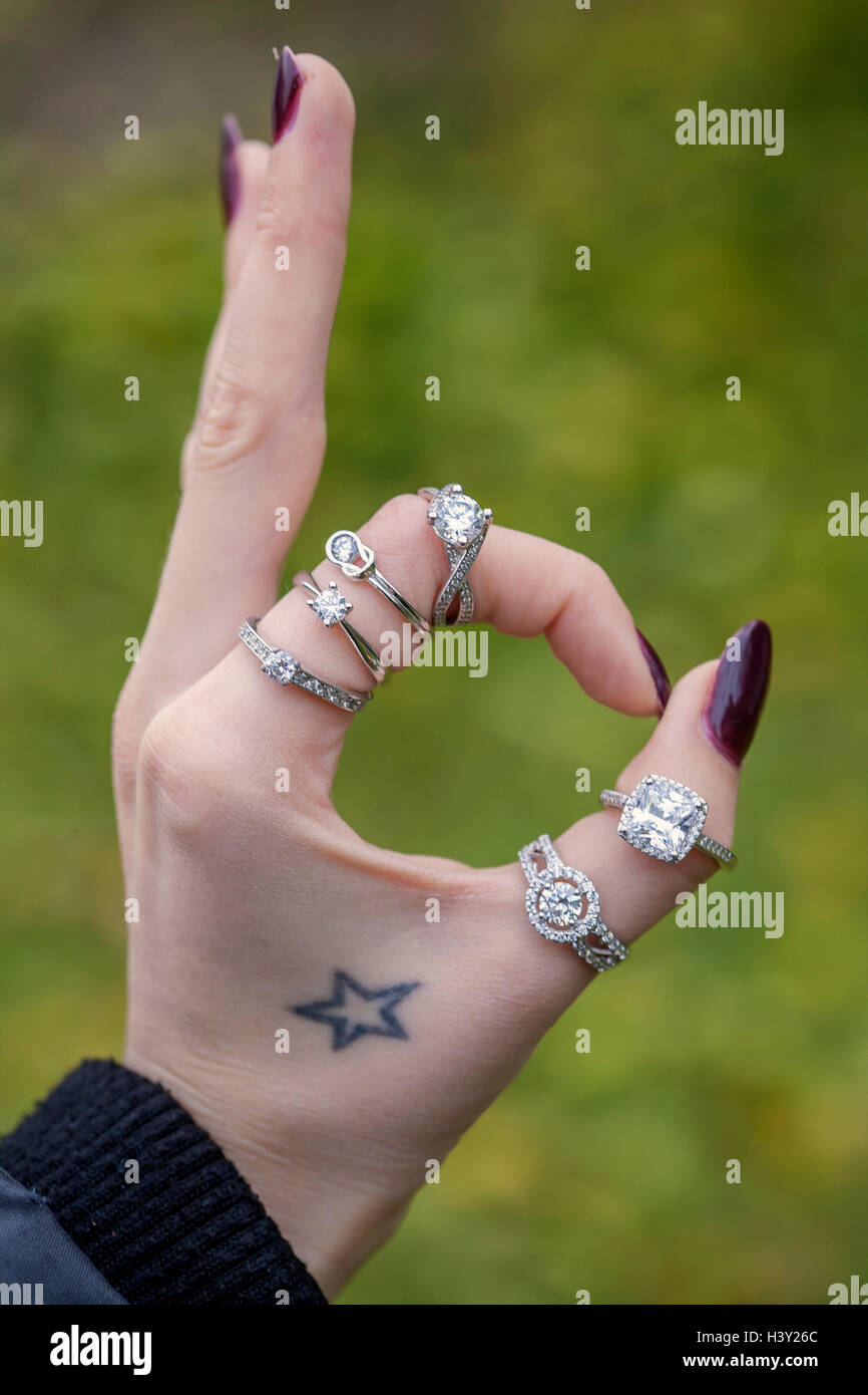 Hand with many rings Stock Photo - Alamy