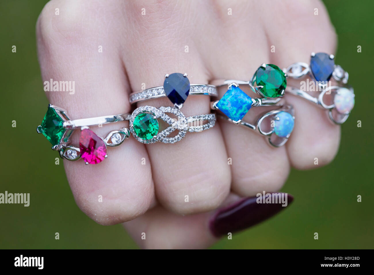 Hand with many rings Stock Photo - Alamy