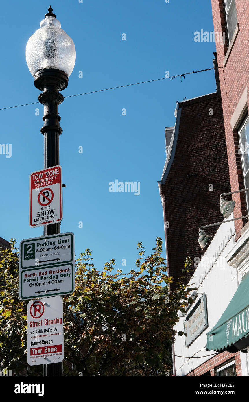 Classic style street light and warning signs on a lamp post in downtown ...