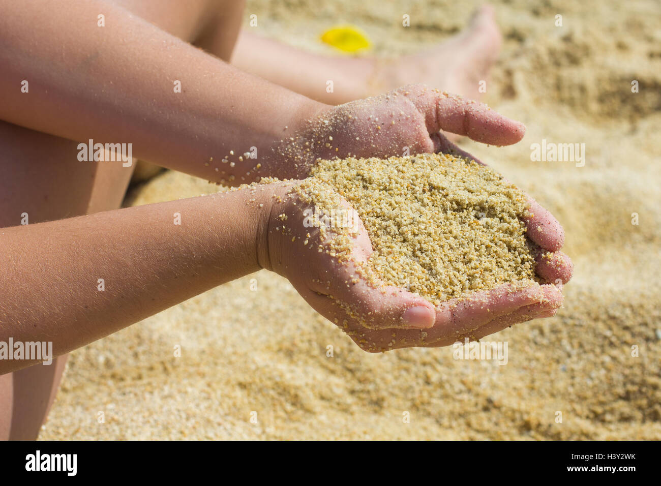 Sand in the woman hands on the beach Stock Photo - Alamy
