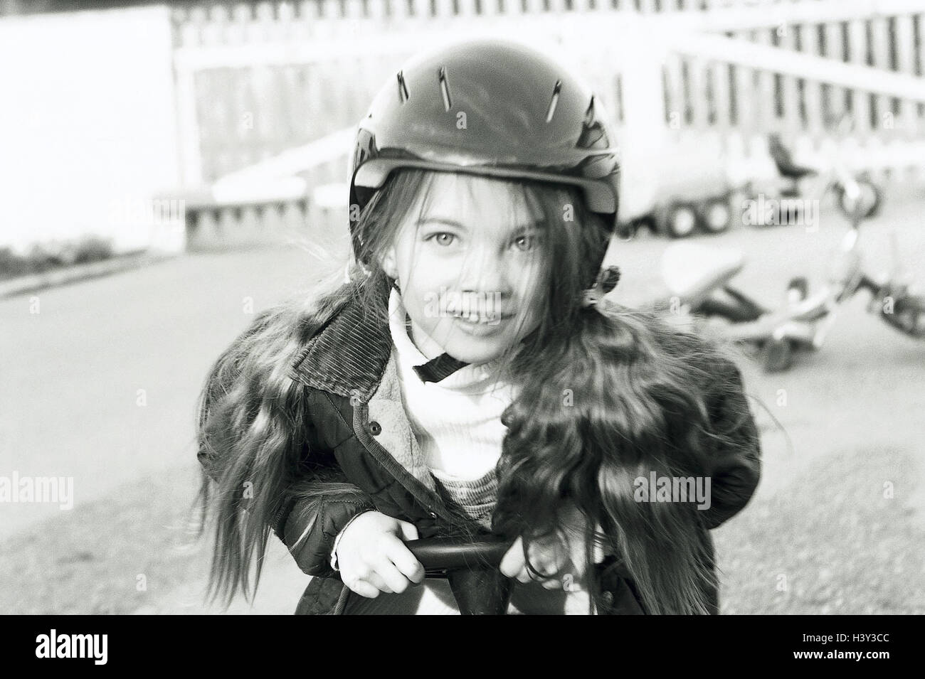 Girls, pedal car, helmet, half portrait, b/w, child, play, game ...
