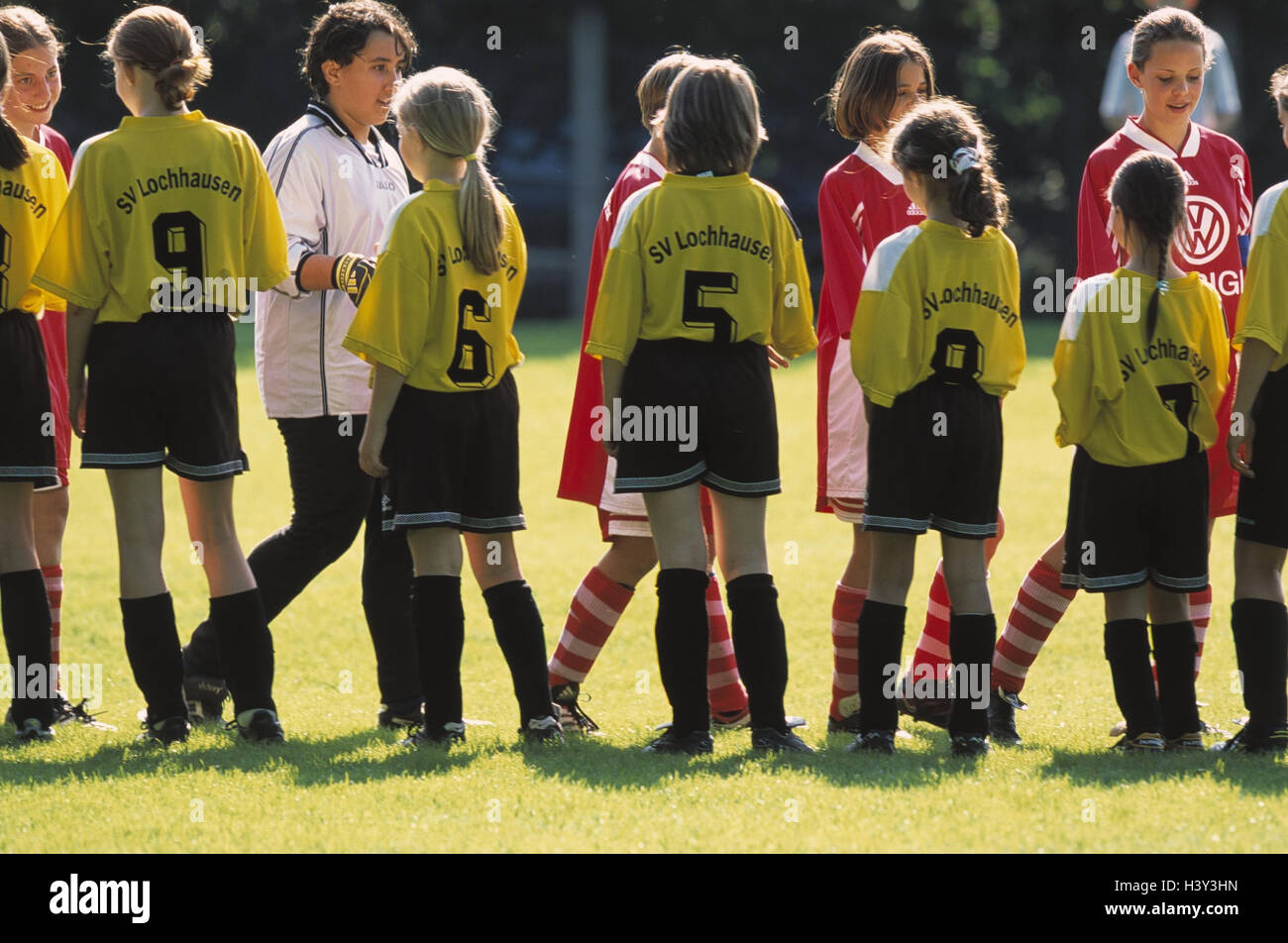 Football teams, girls, line-up, greeting, no model release, children ...