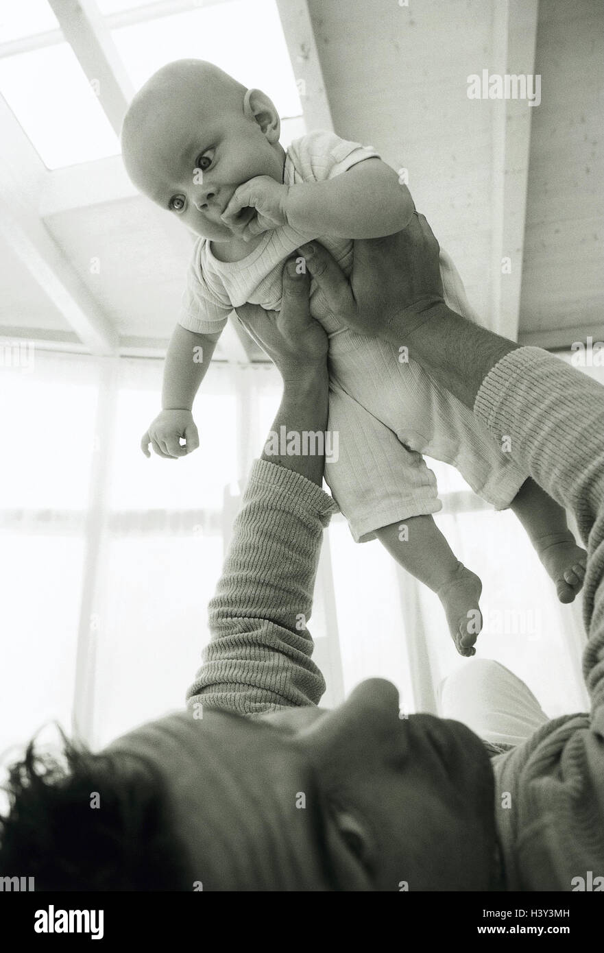 Father, back position, baby, hold, b/w, very close, inside, at home ...