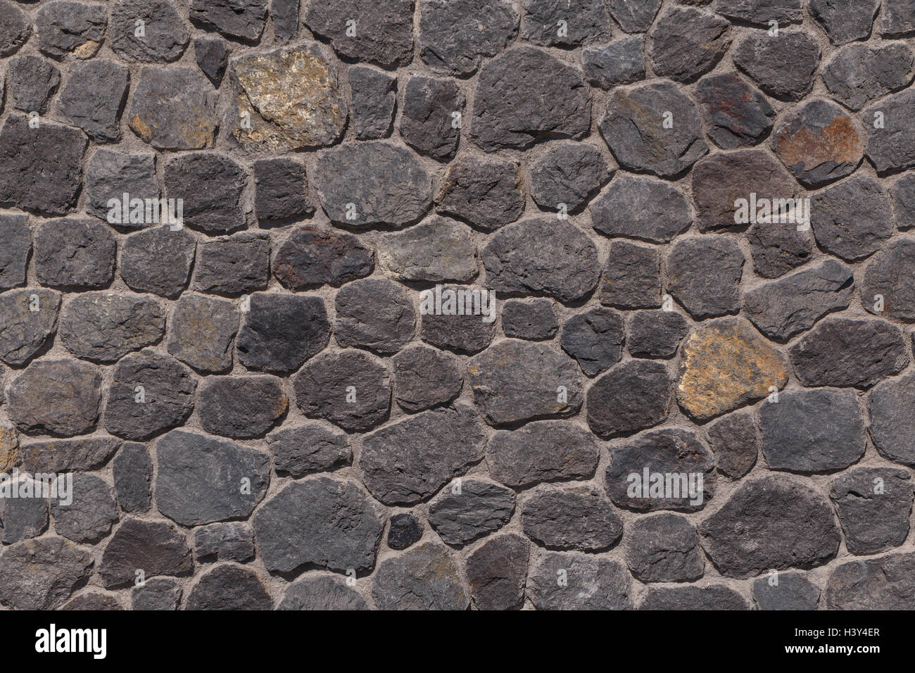 wall made of lava stones on Santorini Stock Photo - Alamy