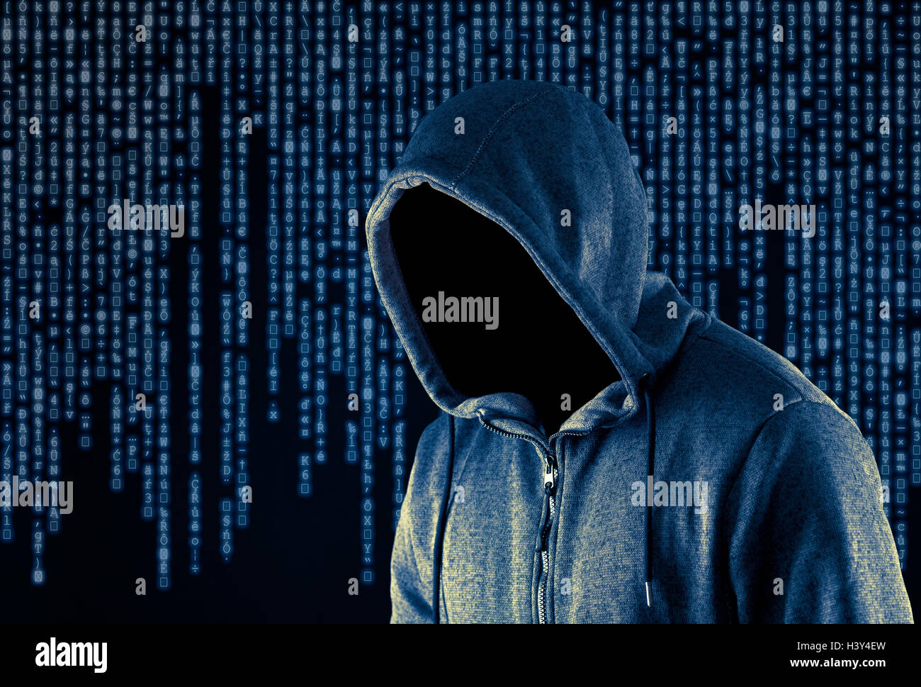Hooded computer hacker Stock Photo - Alamy