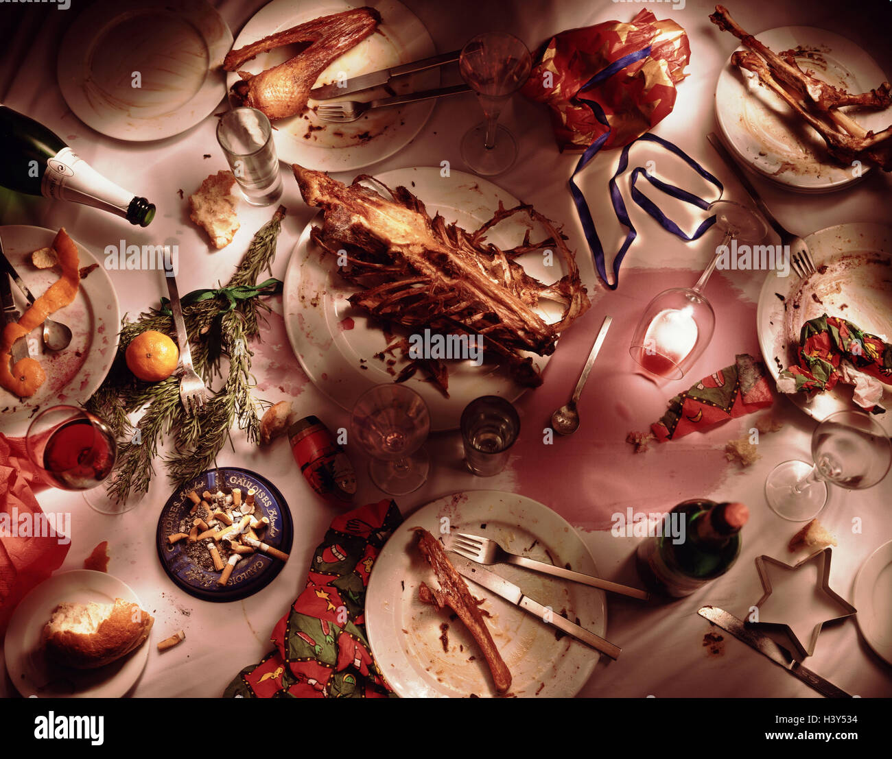 Christmas food, table, mess, leftovers, red wine, buries, ashtray ...