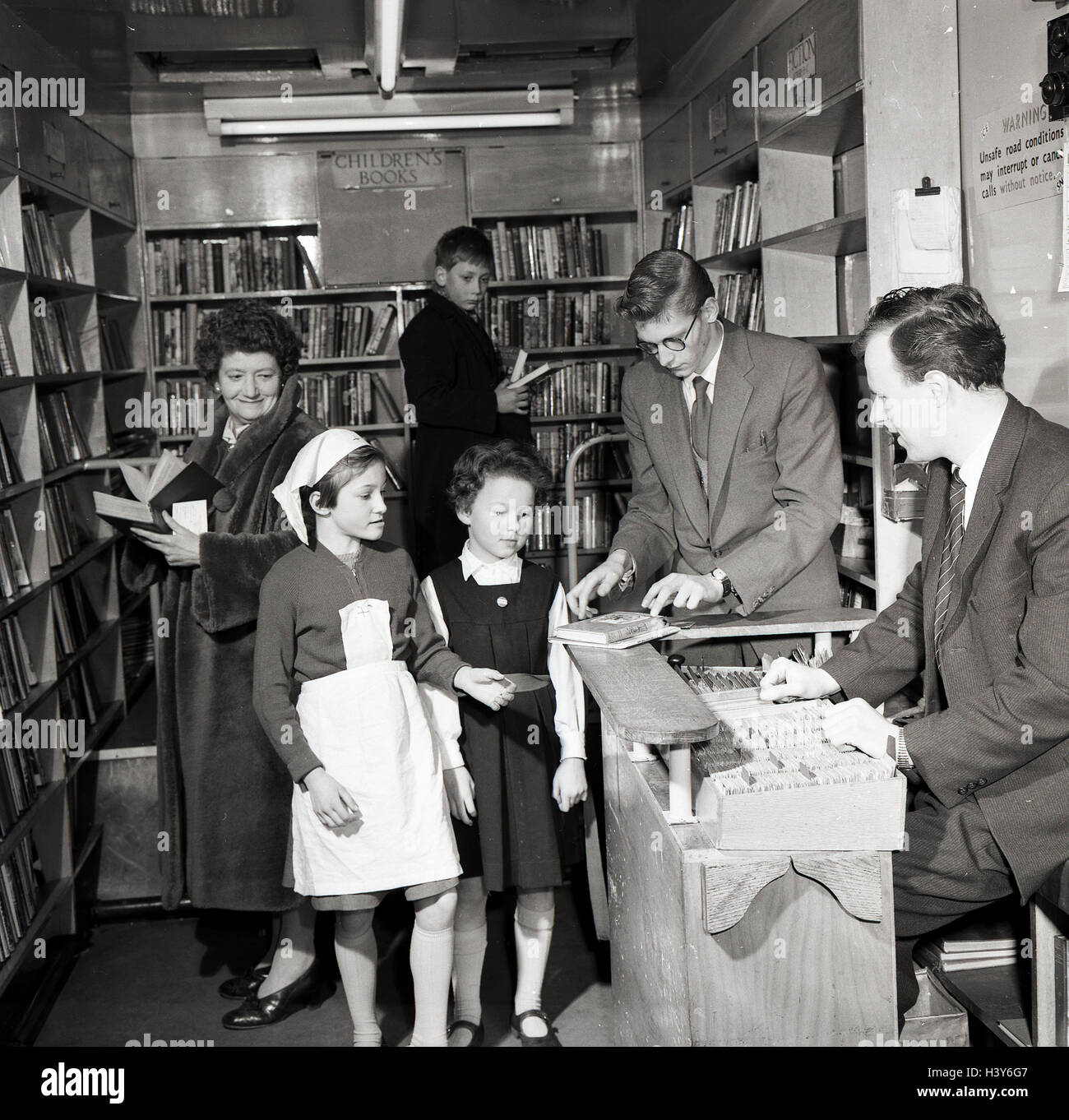 1950s, historical, local people inside a mobile library, London ...