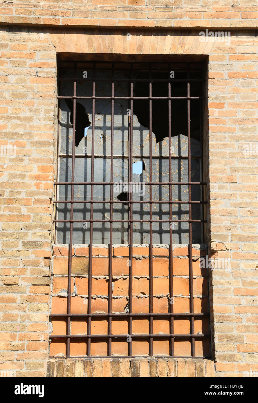 old window of an abandoned house with iron bars Stock Photo - Alamy
