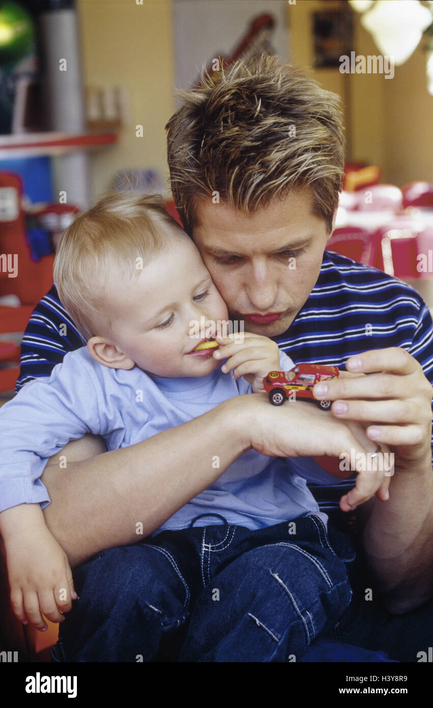 Quick restaurant, father, son, chips, eat, toys car, play, together 30 ...