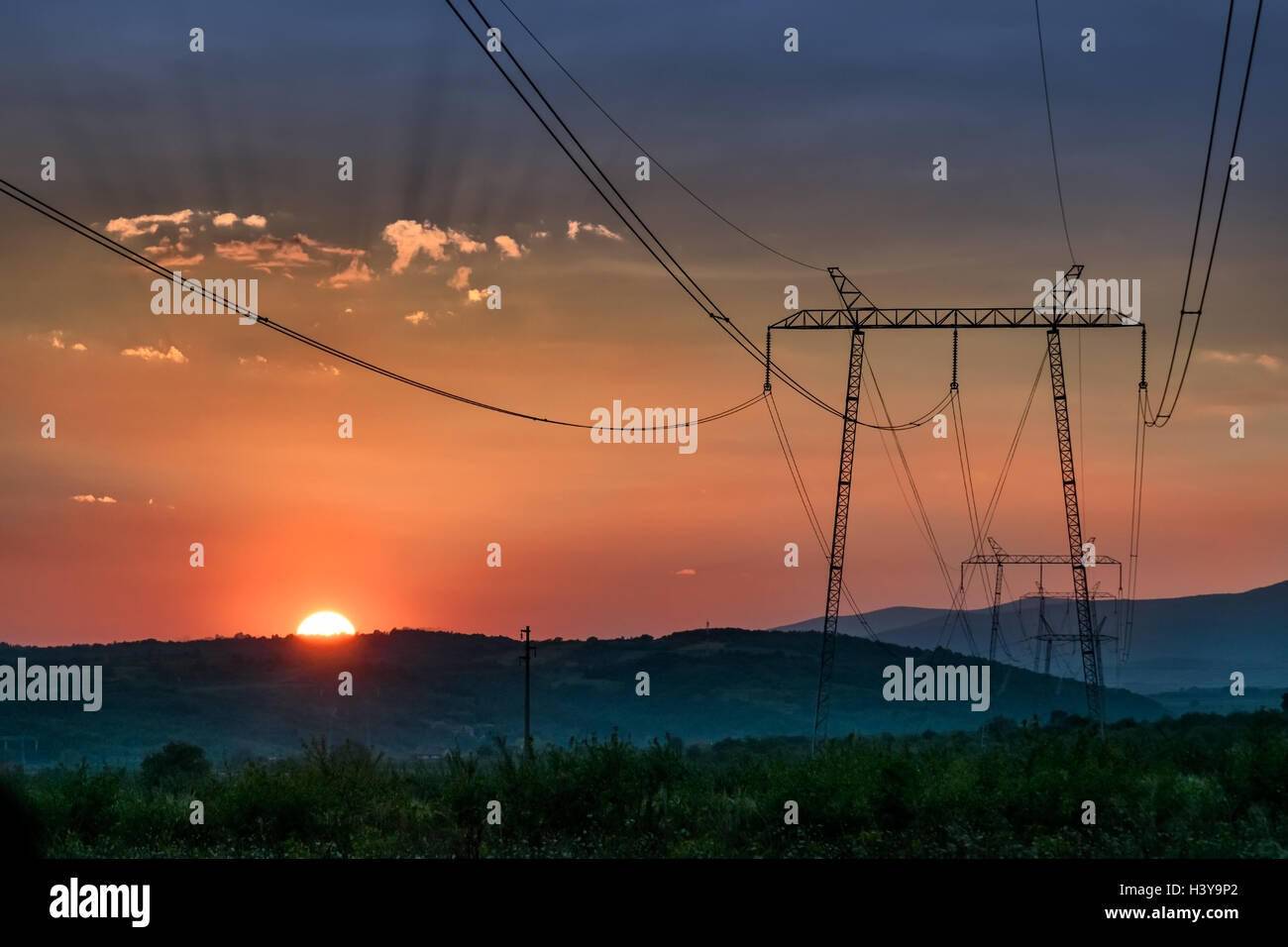 Power line in the sunset Stock Photo - Alamy