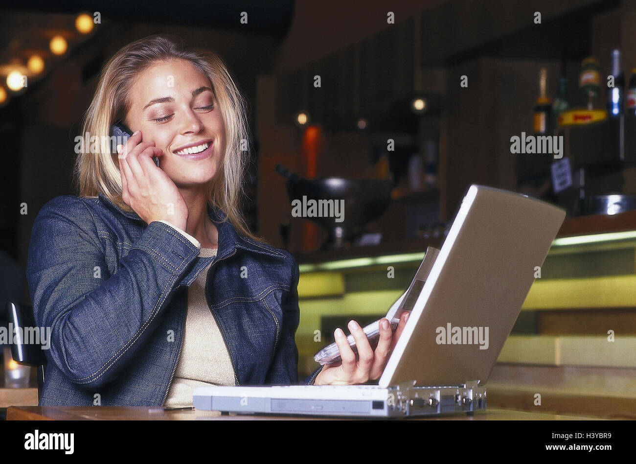 Locally, woman, laptop, mobile phone, call up, sit inside, cafe, young ...