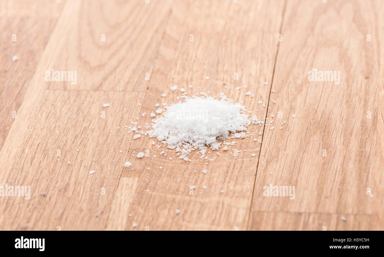 Salt on a wooden table. Food background with copy space Stock Photo - Alamy