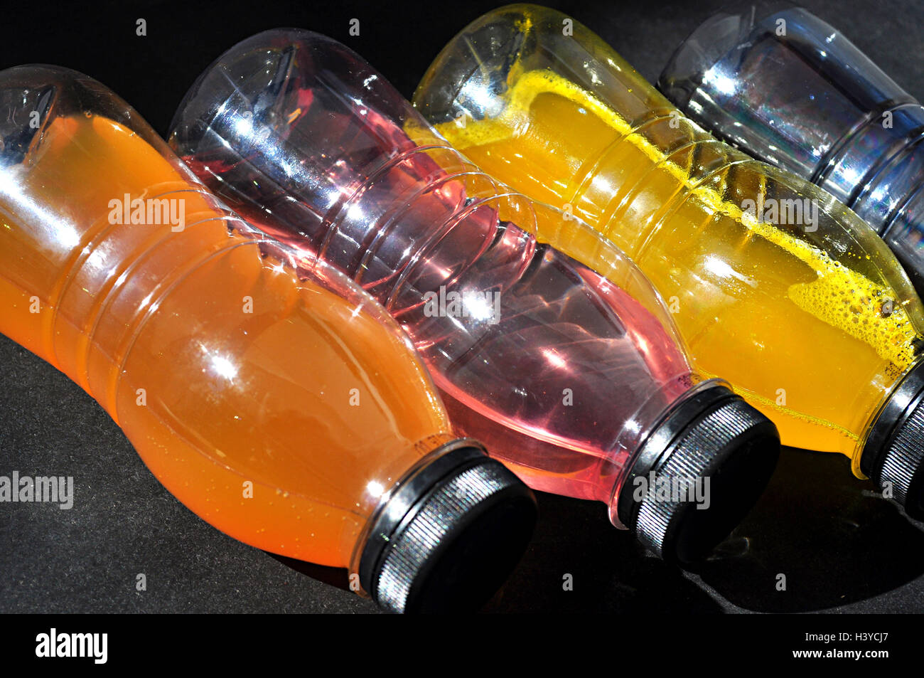 plastic bottles with colored liquid Stock Photo - Alamy